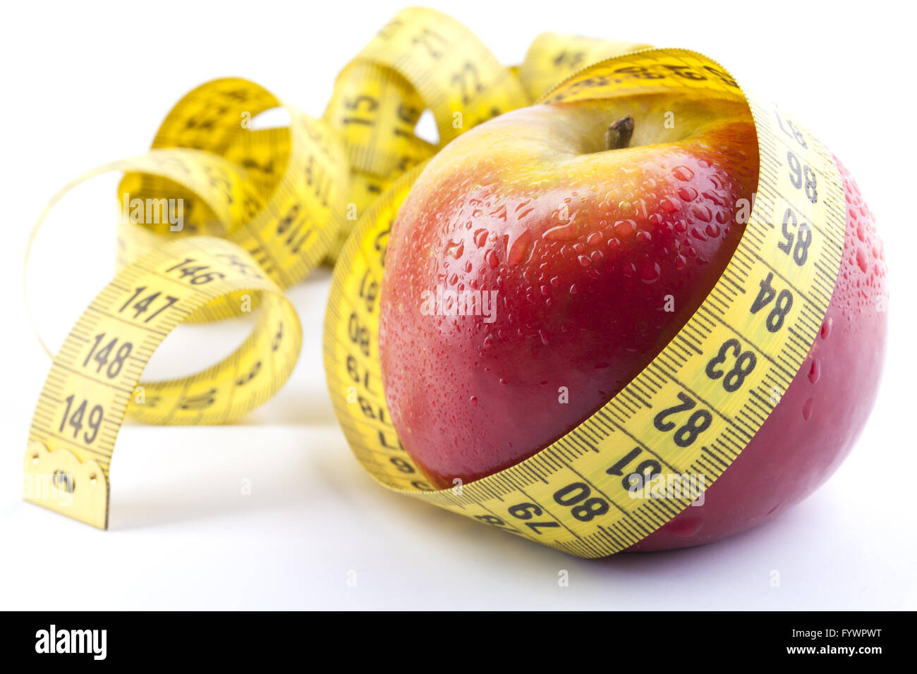 Red Apple With Yellow Tape Stock Photo - Alamy