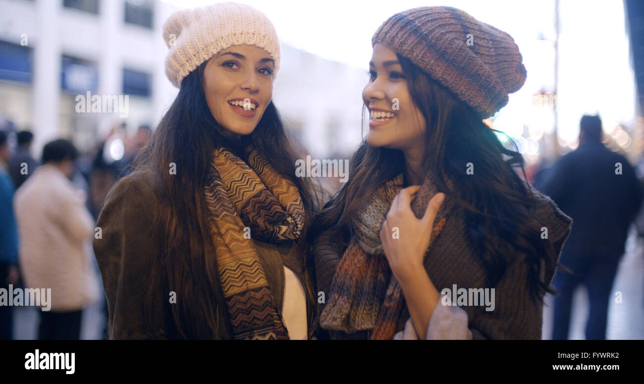 Two stylish young women in winter fashion Stock Photo - Alamy