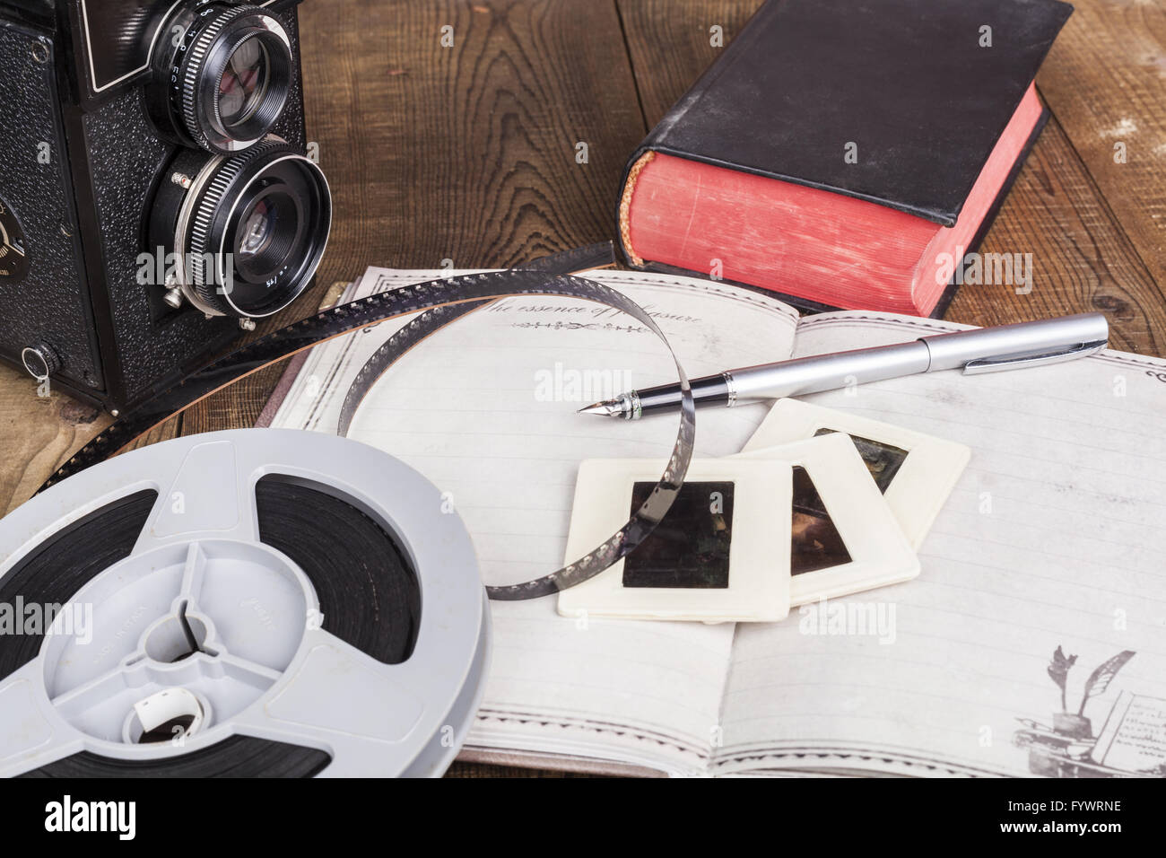 Film Roll And Camera Stock Photo - Alamy