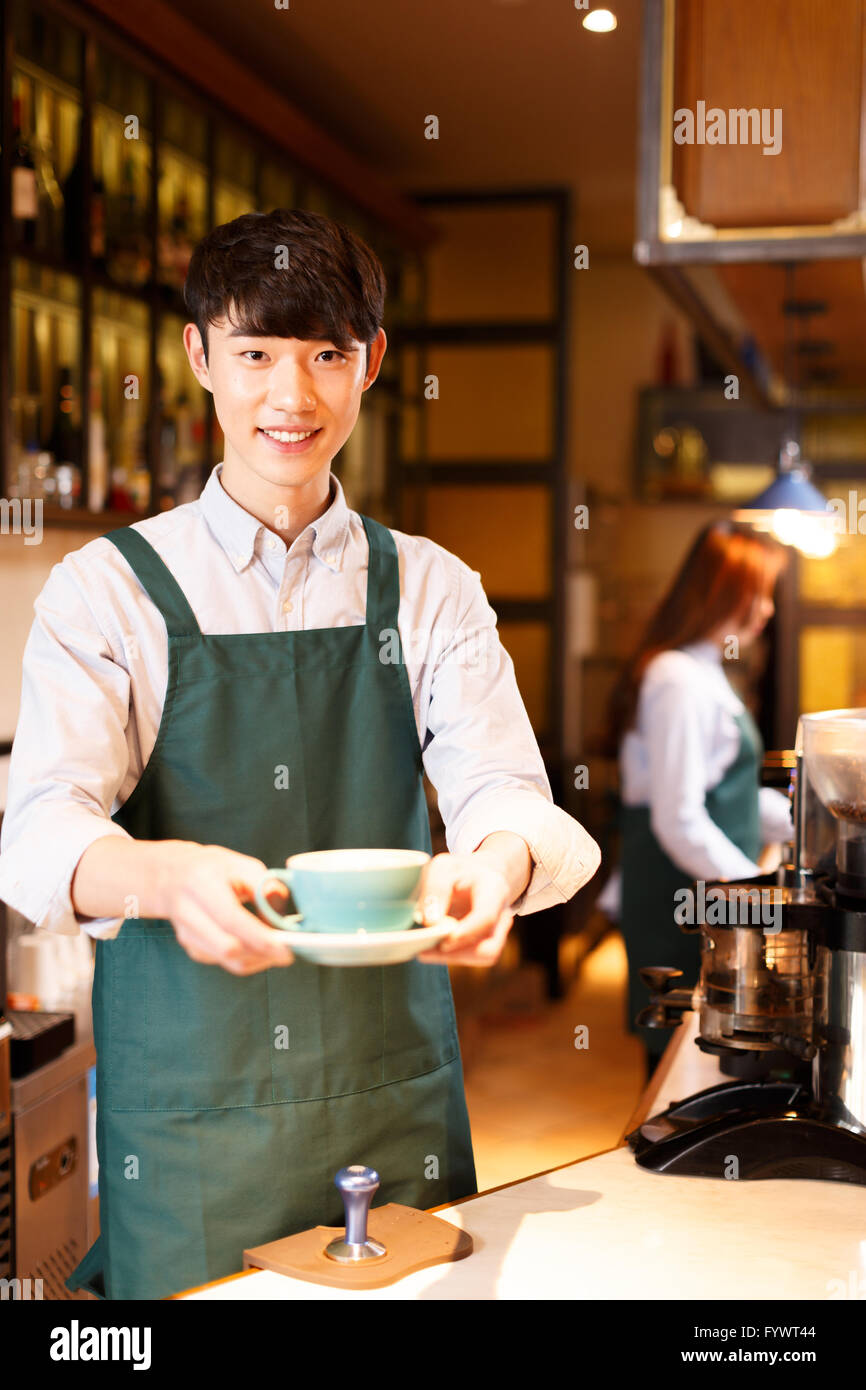 waitress and waiter are serving Stock Photo - Alamy
