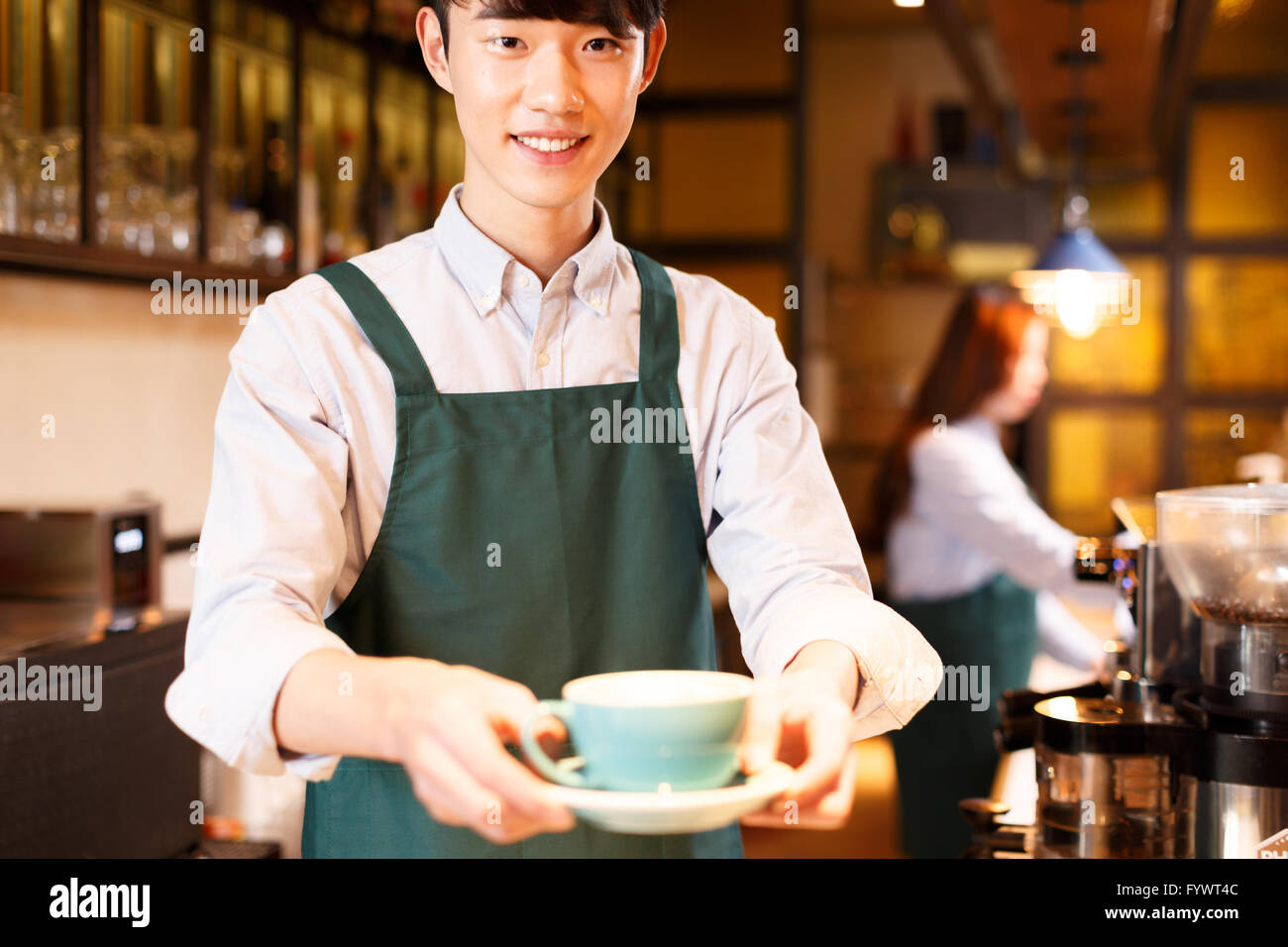 waitress and waiter are serving Stock Photo - Alamy