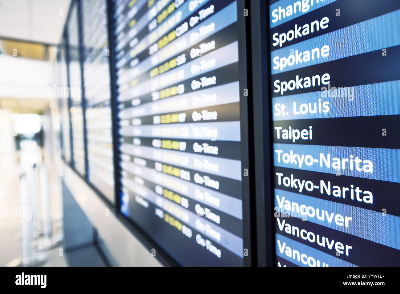info of flight on billboard in airport Stock Photo - Alamy