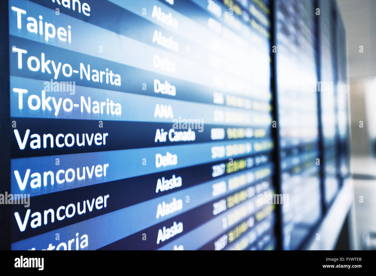 info of flight on billboard in airport Stock Photo - Alamy