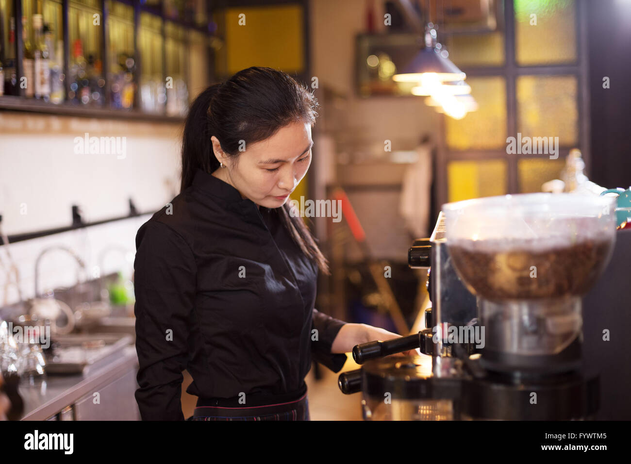 waitress serving in modern cafe Stock Photo - Alamy