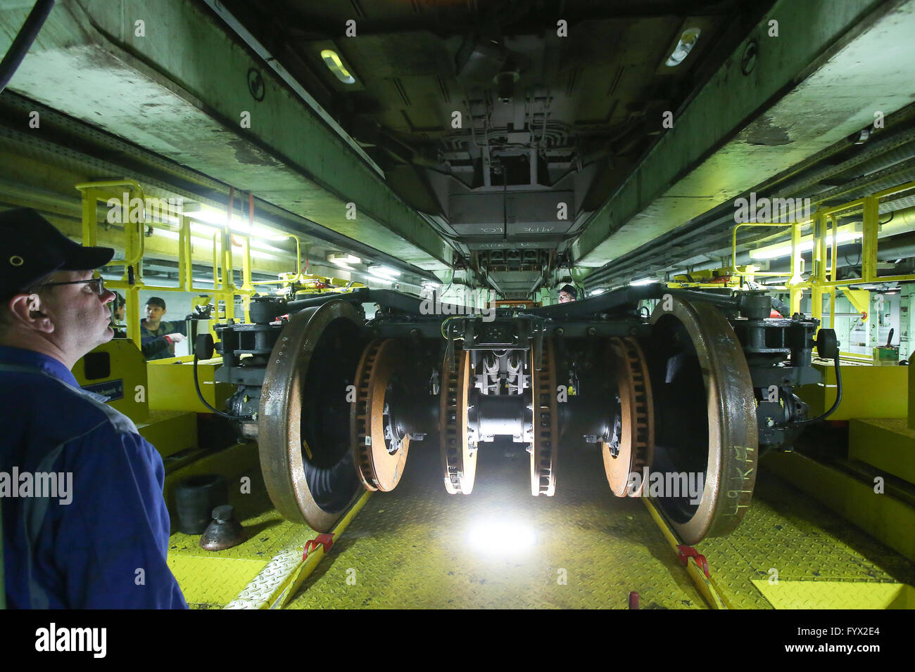 Hamburg, Germany. 26th Apr, 2016. Employees work on a bogie of an ...