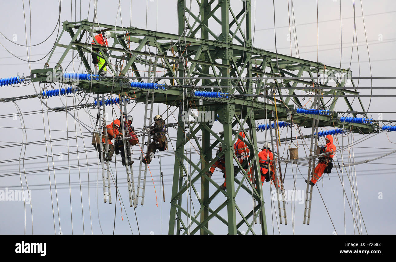Wolmirstedt, Germany. 28th Apr, 2016. People work on high-voltage power ...