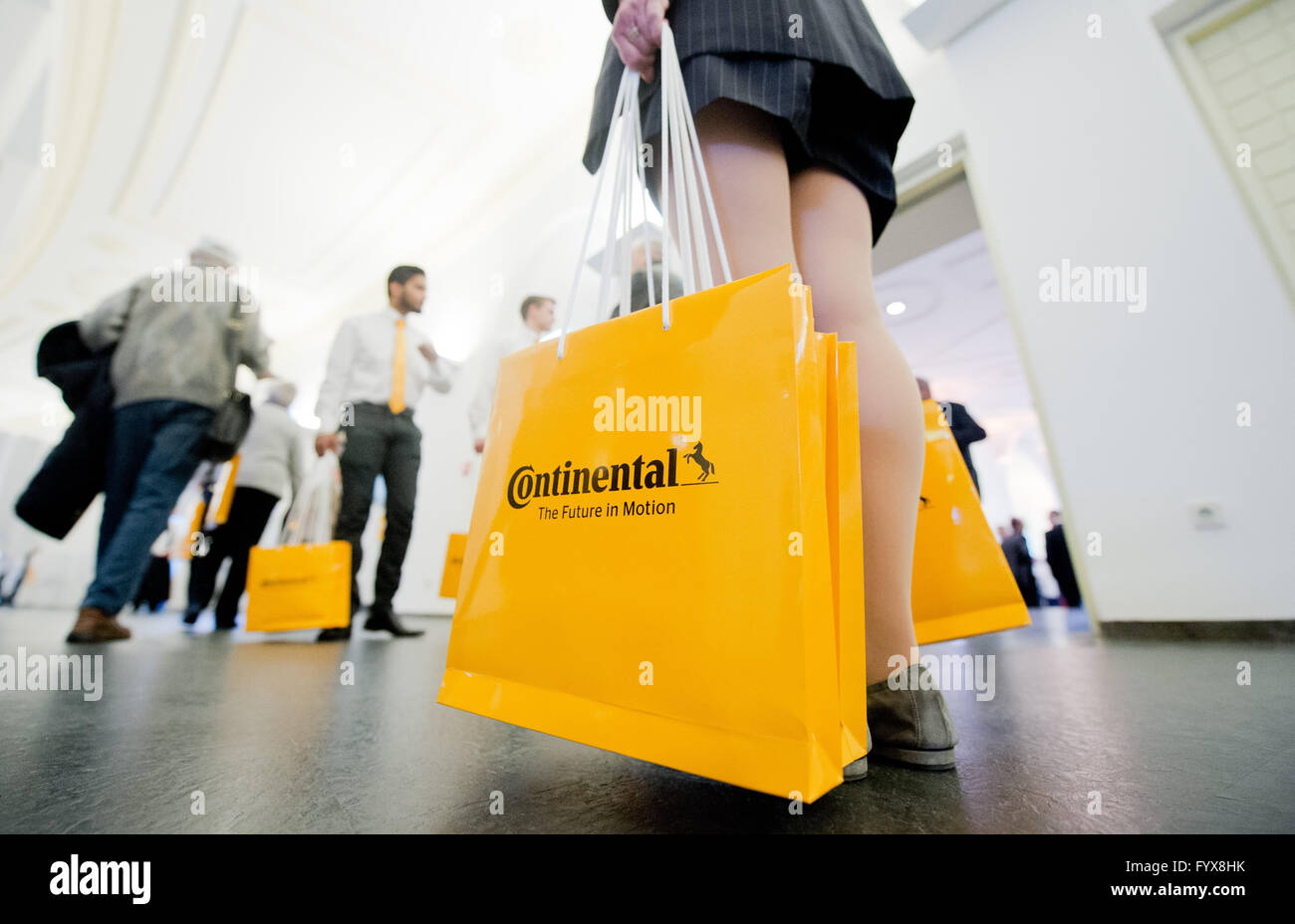 Hanover, Germany. 29th Apr, 2016. Employees handing out bags during the ...