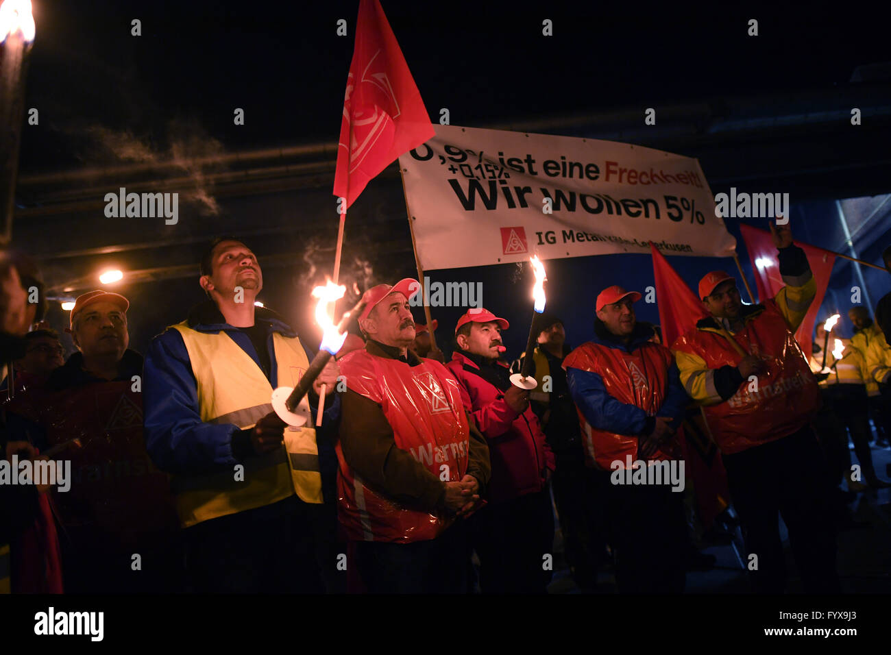 Staff members of car maker Ford take part in a warning strike during ...