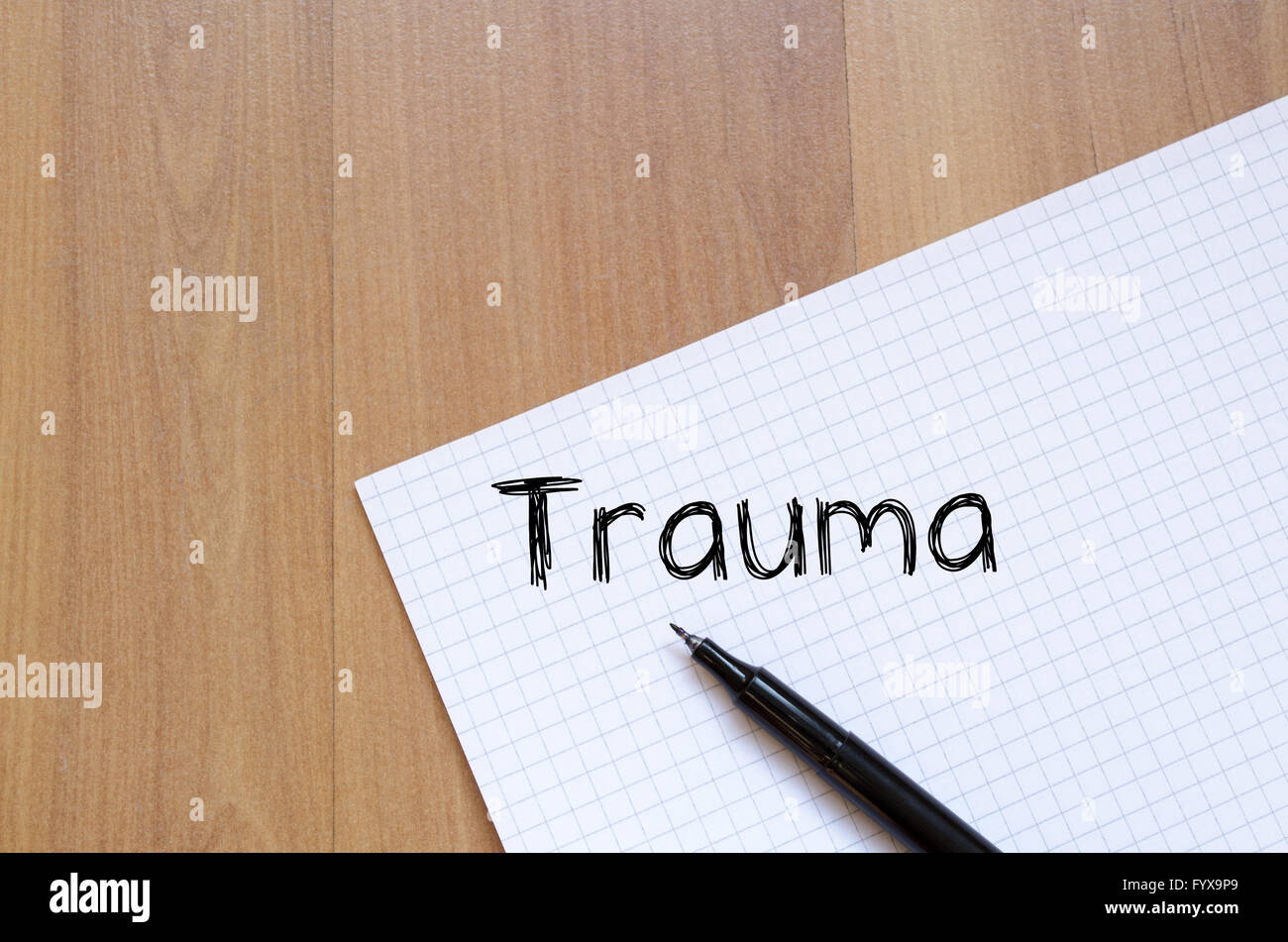 Trauma write on notebook Stock Photo - Alamy