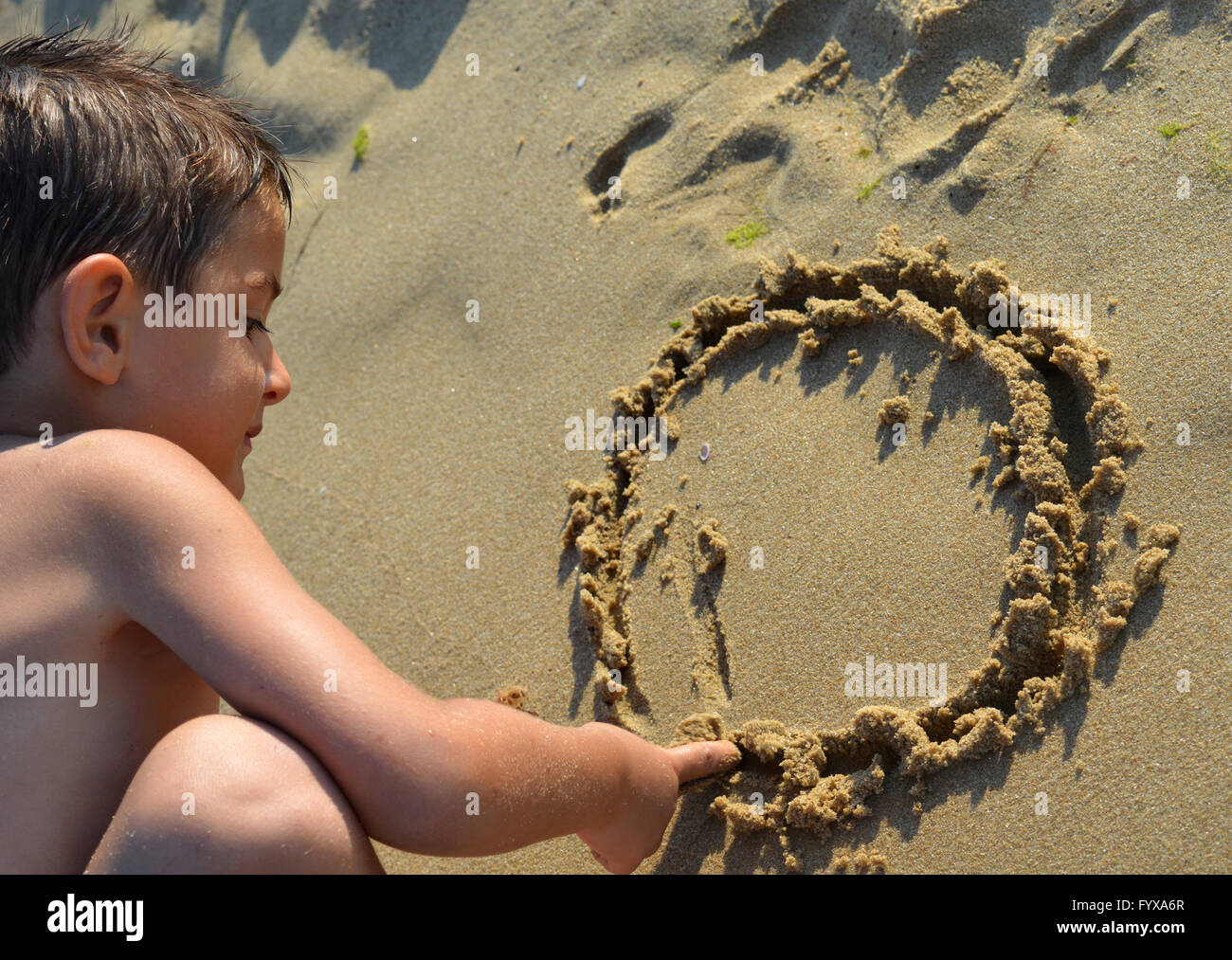 Drawing in the sand Stock Photo - Alamy