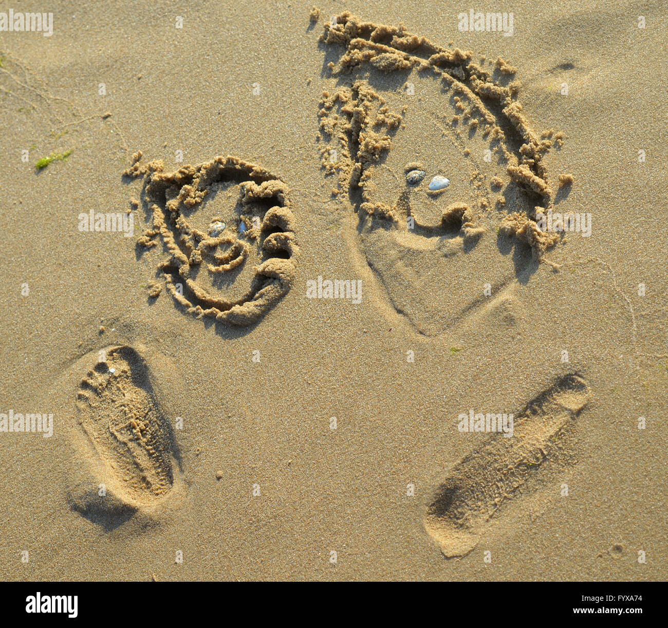Drawing on the sand Stock Photo - Alamy