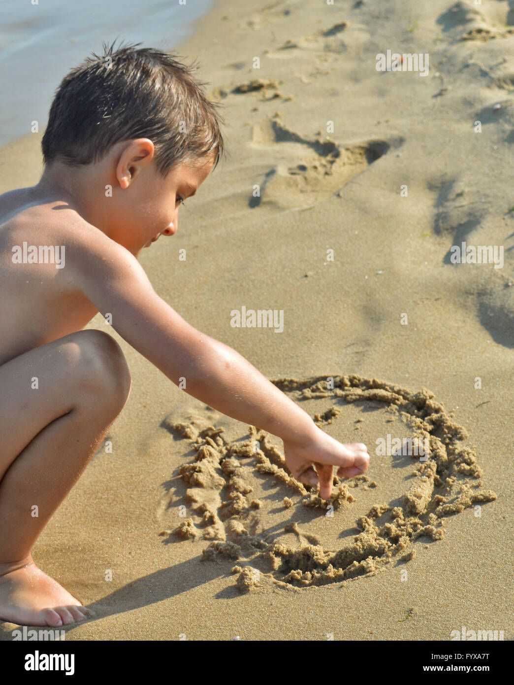 Drawing in the sand Stock Photo - Alamy