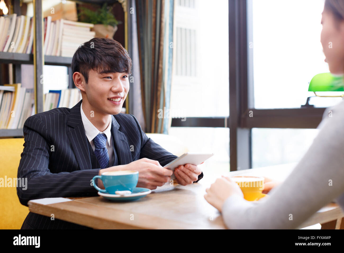 people relaxing in cafe Stock Photo - Alamy