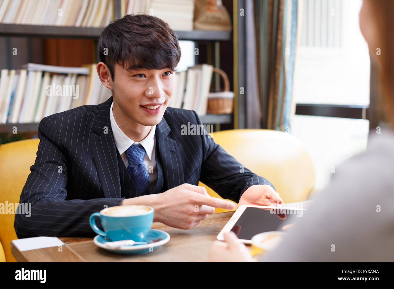 people relaxing in cafe Stock Photo - Alamy