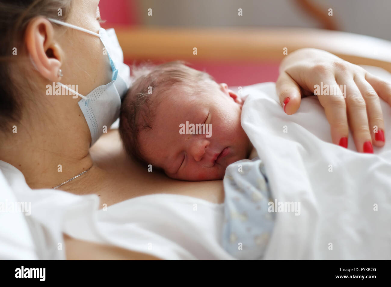 One day old newborn baby with mother Stock Photo - Alamy