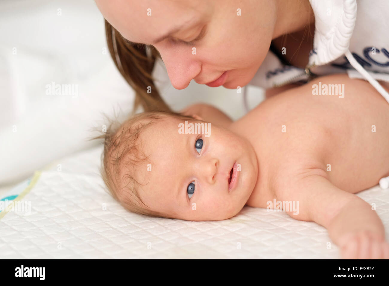 One month old newborn baby with mother Stock Photo - Alamy
