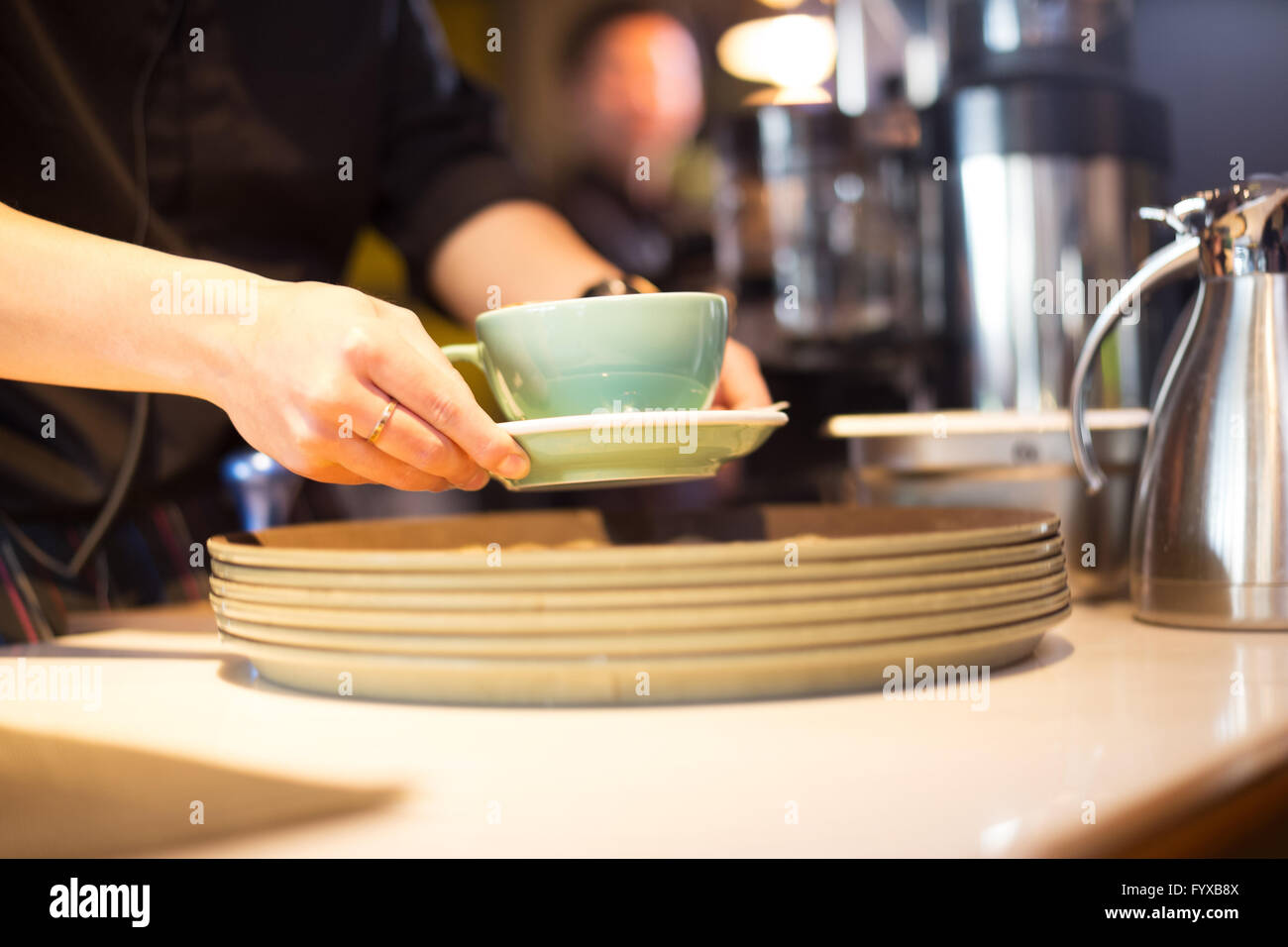 waiter serving in cafe Stock Photo - Alamy