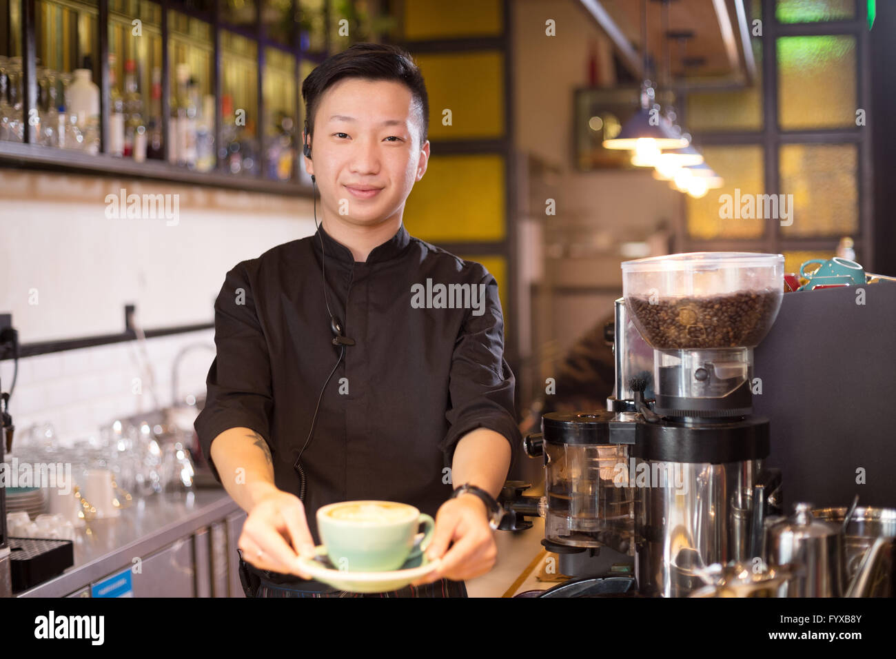 waiter serving in cafe Stock Photo - Alamy