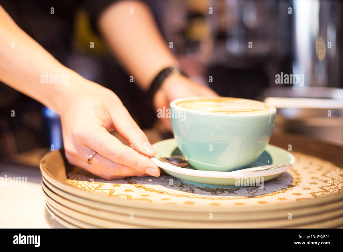 waiter serving in cafe Stock Photo - Alamy