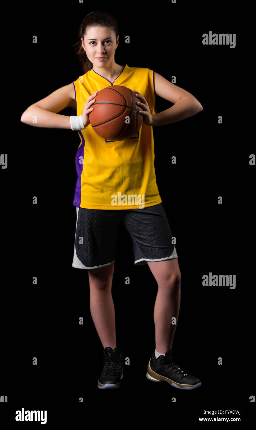 Young girl basketball player isolated Stock Photo - Alamy