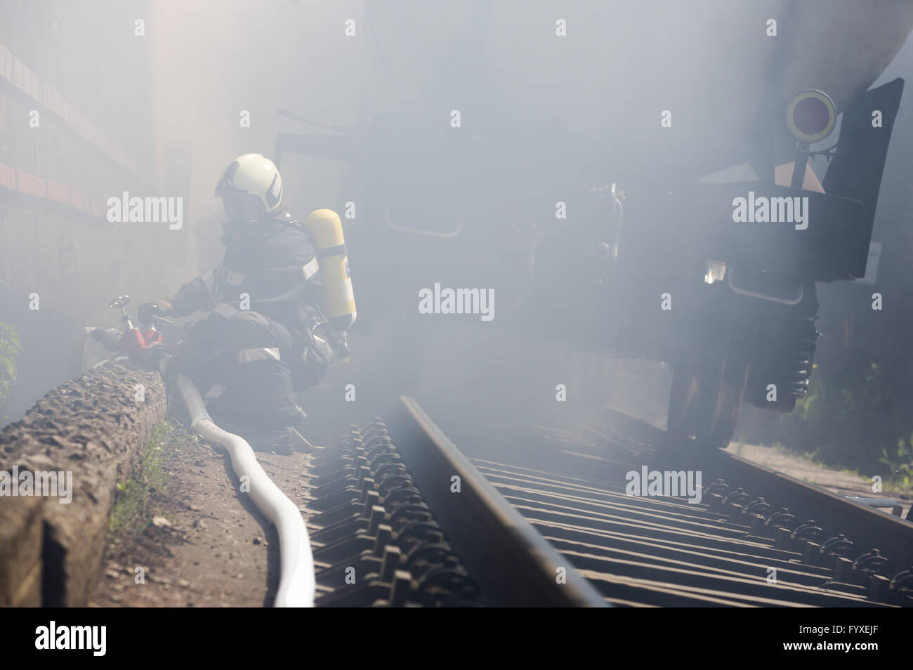 Tanker train fire firefighters Stock Photo - Alamy