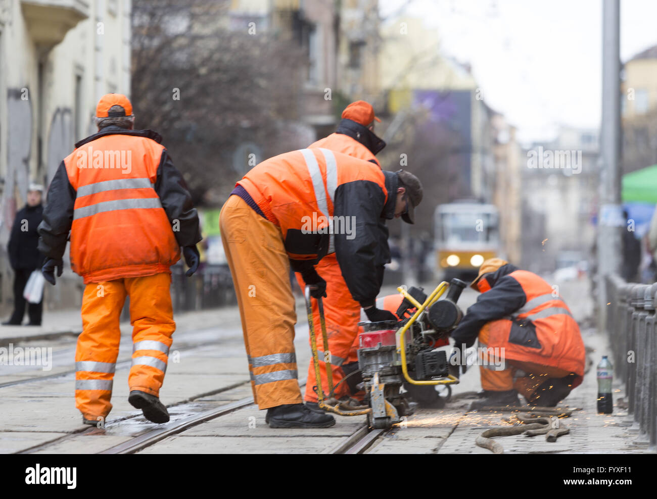 Tram road workers repair repairing Stock Photo - Alamy