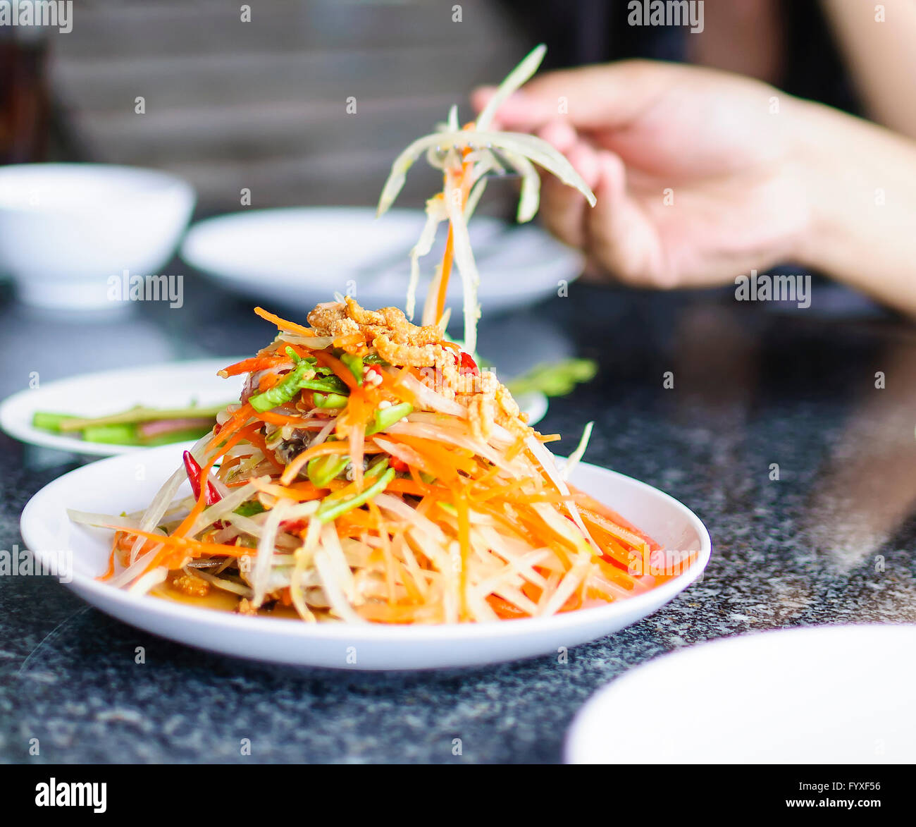 Som Tam Thai - Thai green papaya salad with peanuts Stock Photo - Alamy