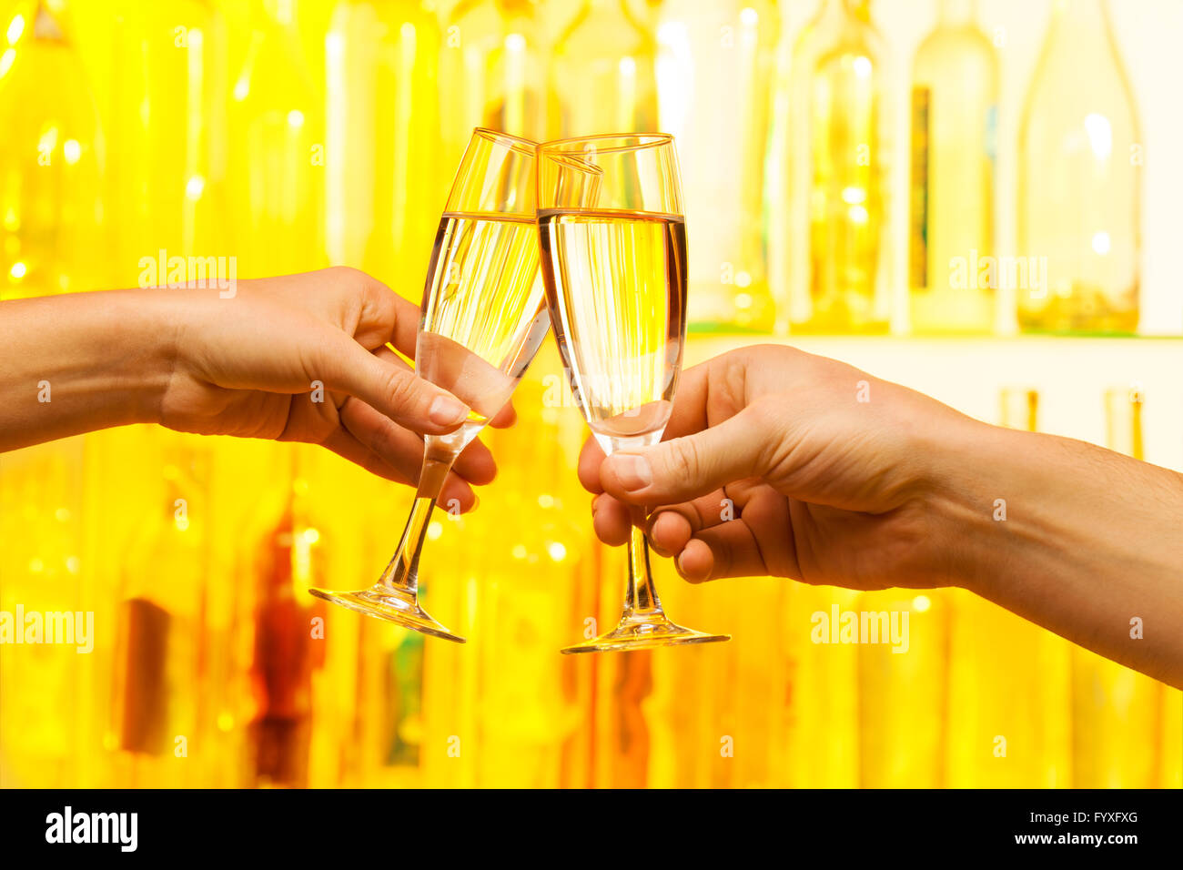 Hands holding champagne glasses hi-res stock photography and images - Alamy
