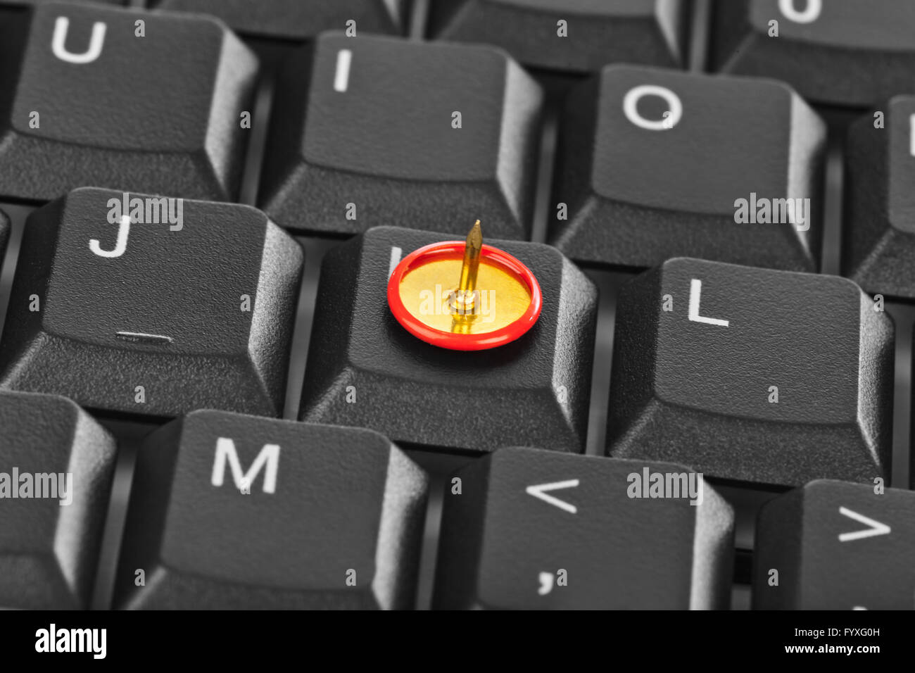 Pin on computer keyboard Stock Photo - Alamy