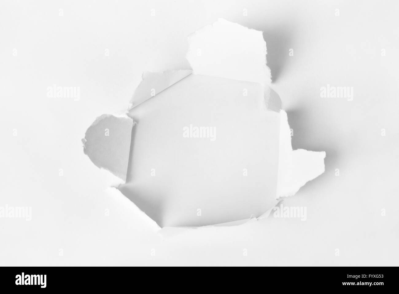 Hole punched in the paper Stock Photo - Alamy
