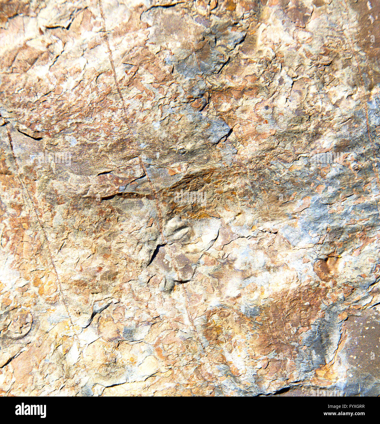 rocks stone and red orange gneiss in the wall of morocco Stock Photo ...