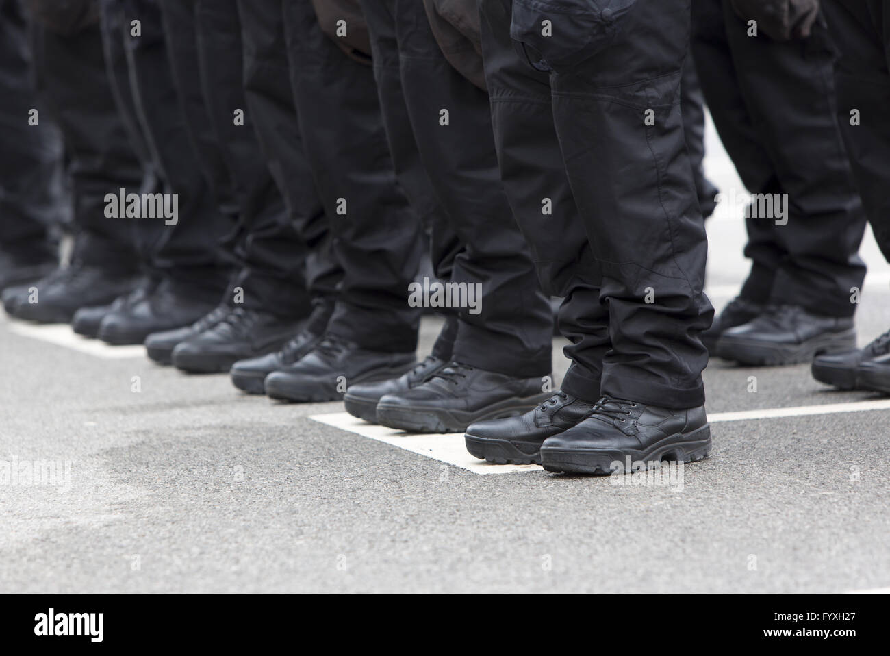 Policemen holding hands hi-res stock photography and images - Alamy