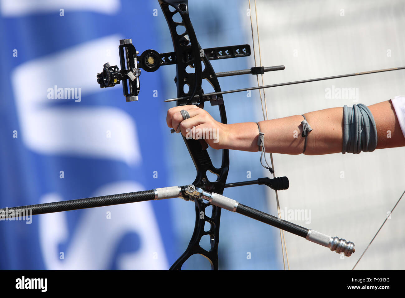 Bow and arrow in the hands of an archer Stock Photo - Alamy