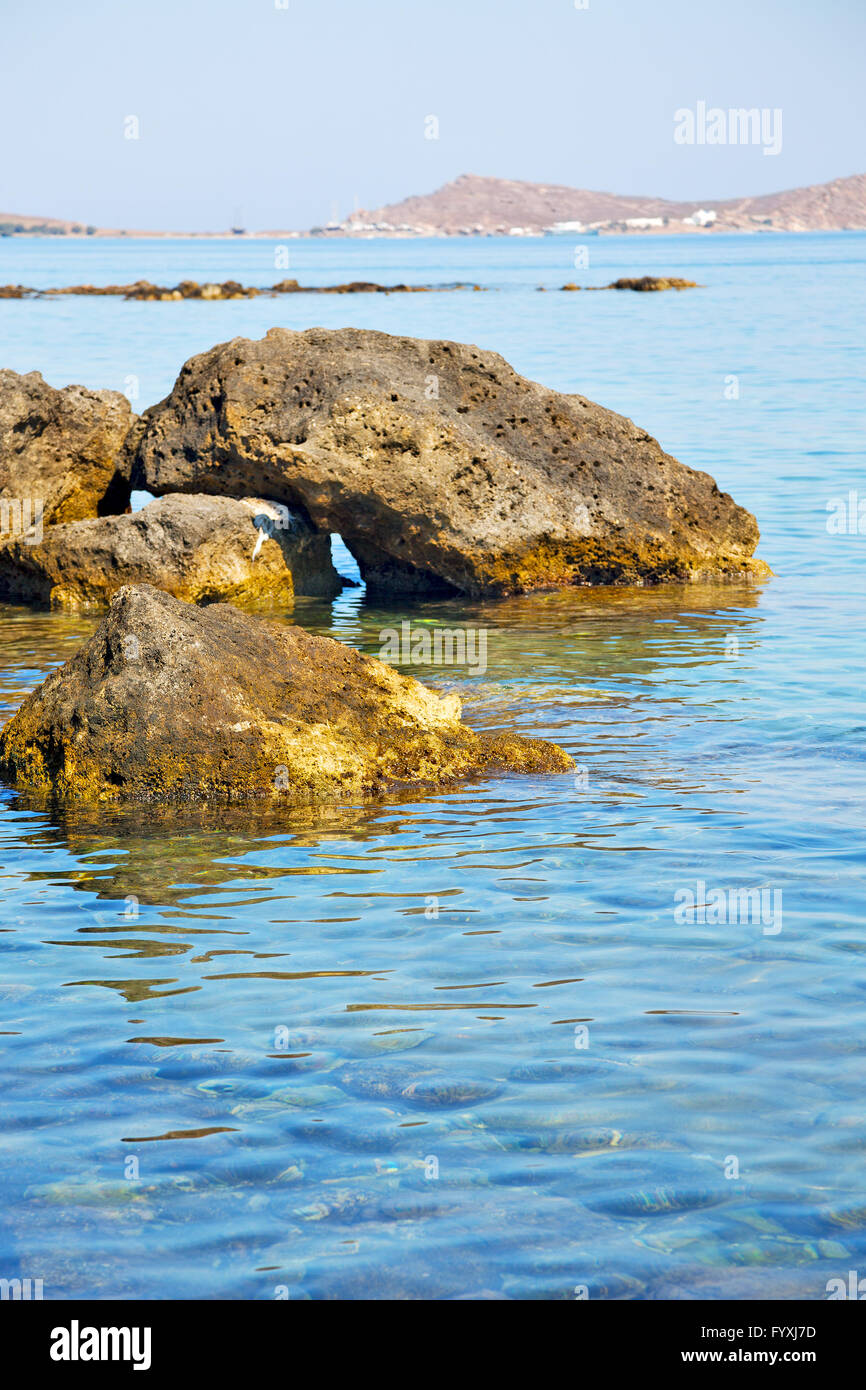 brown stone in light ocean white sky Stock Photo - Alamy