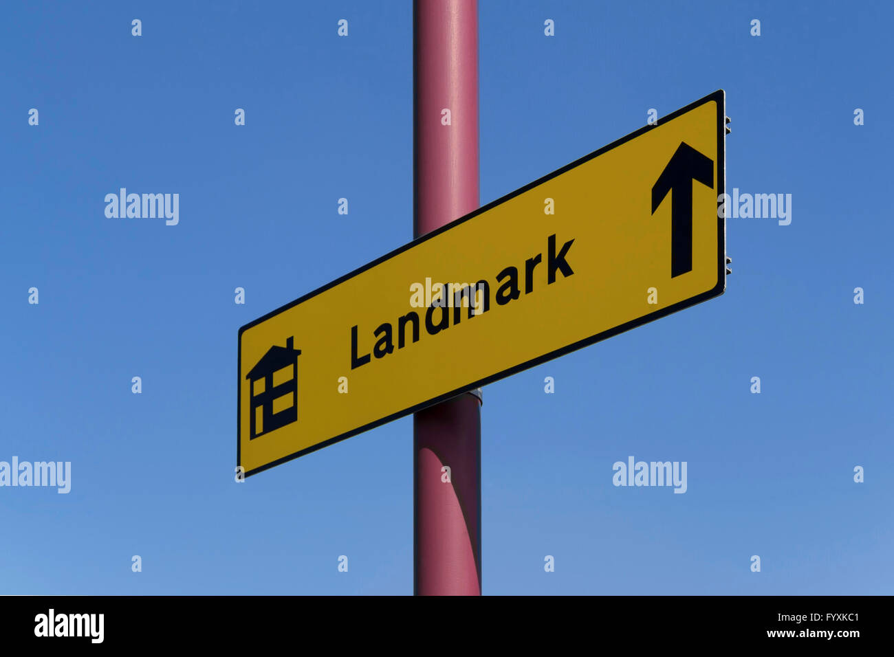 Yellow sign reading 'Landmark' with black border, arrow and house icon ...