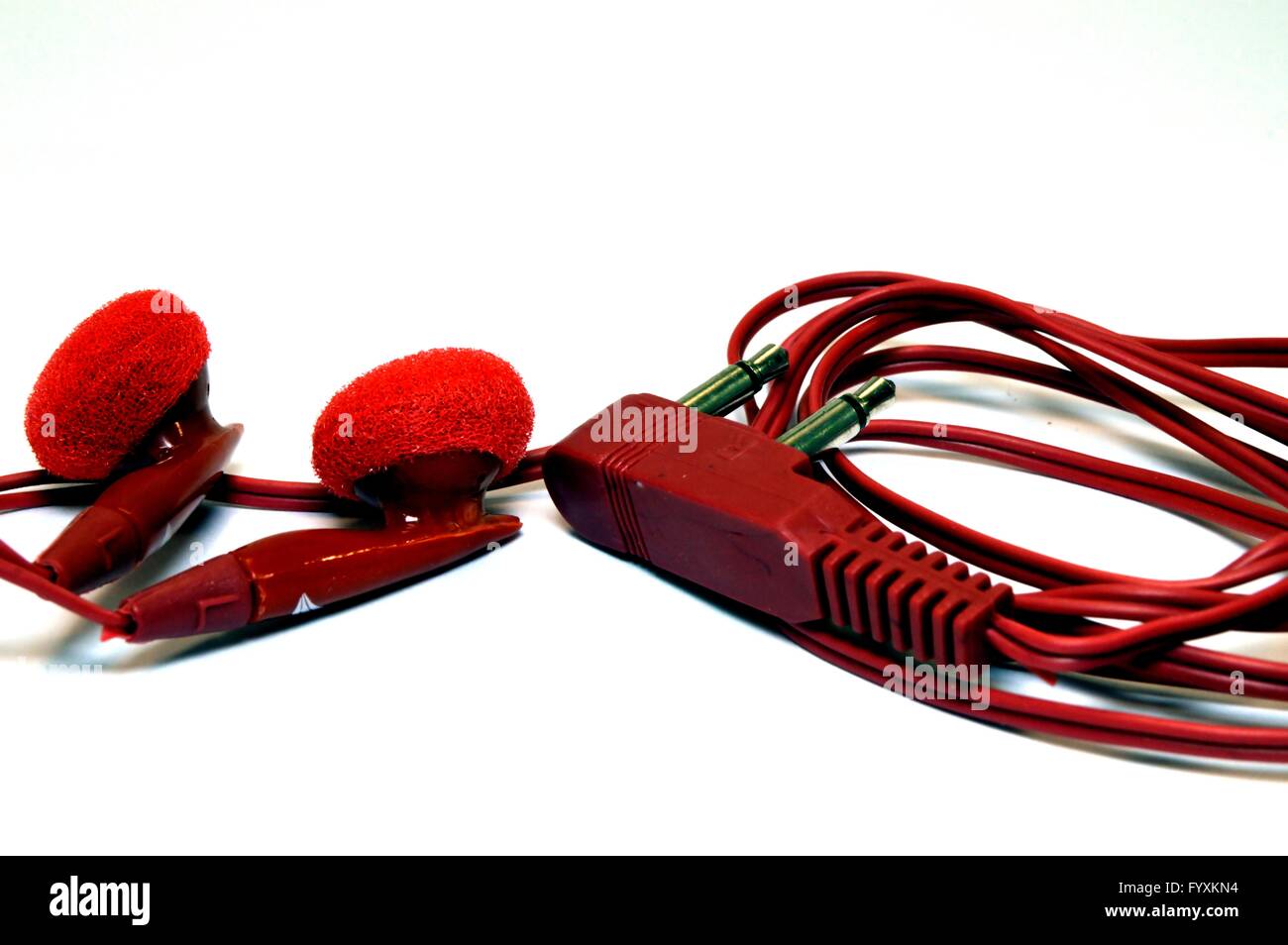 Earphones of red color for portable devices Stock Photo - Alamy