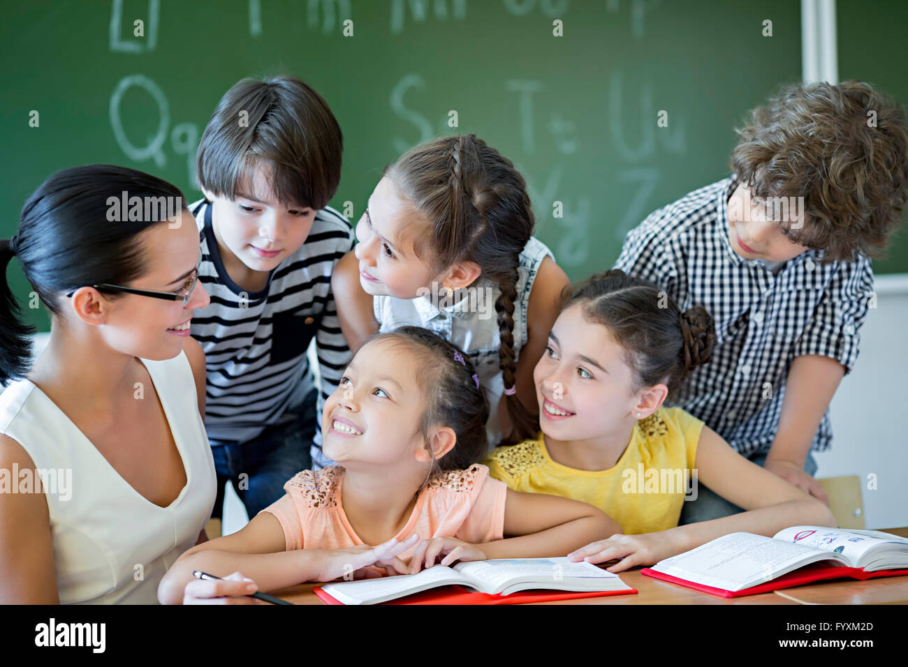 Adult teaching children hi-res stock photography and images - Alamy