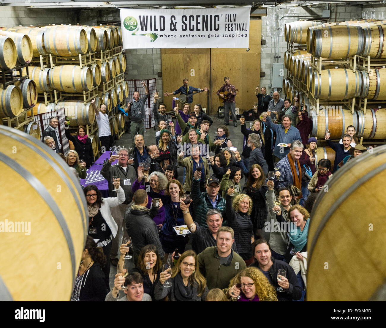Winery Party in barrel room Stock Photo - Alamy