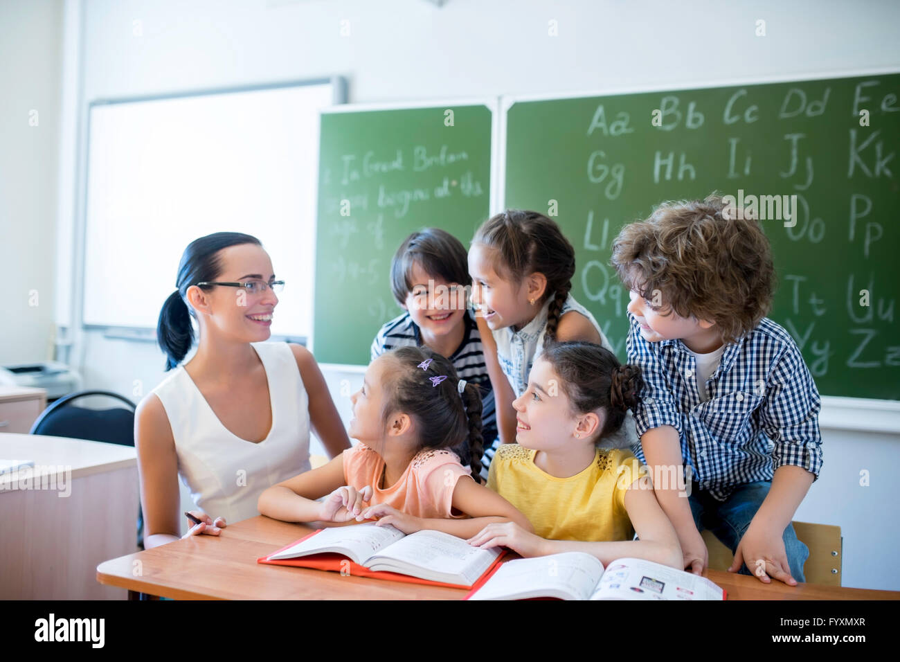 Pupils with teacher Stock Photo - Alamy