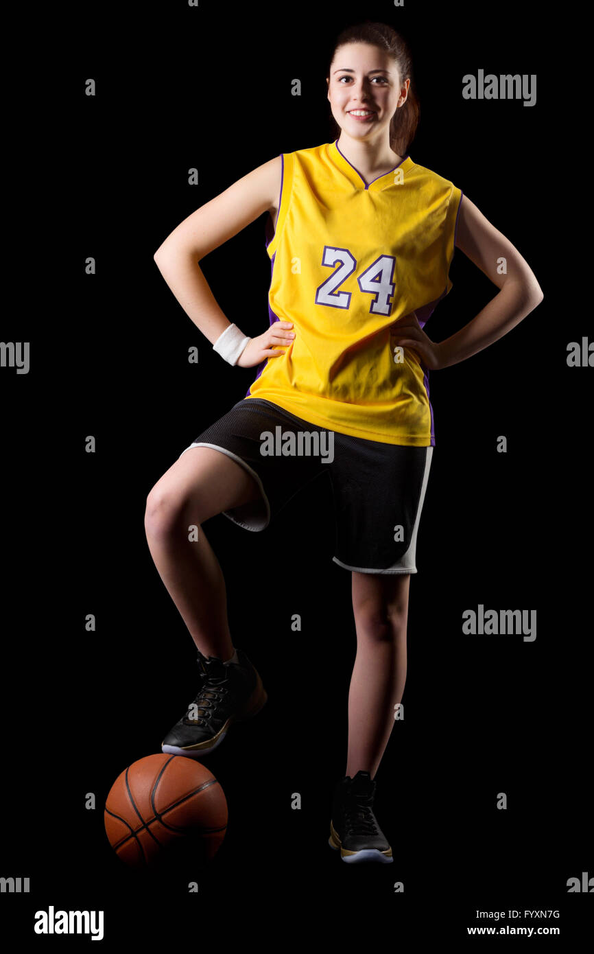 Young girl basketball player isolated Stock Photo - Alamy