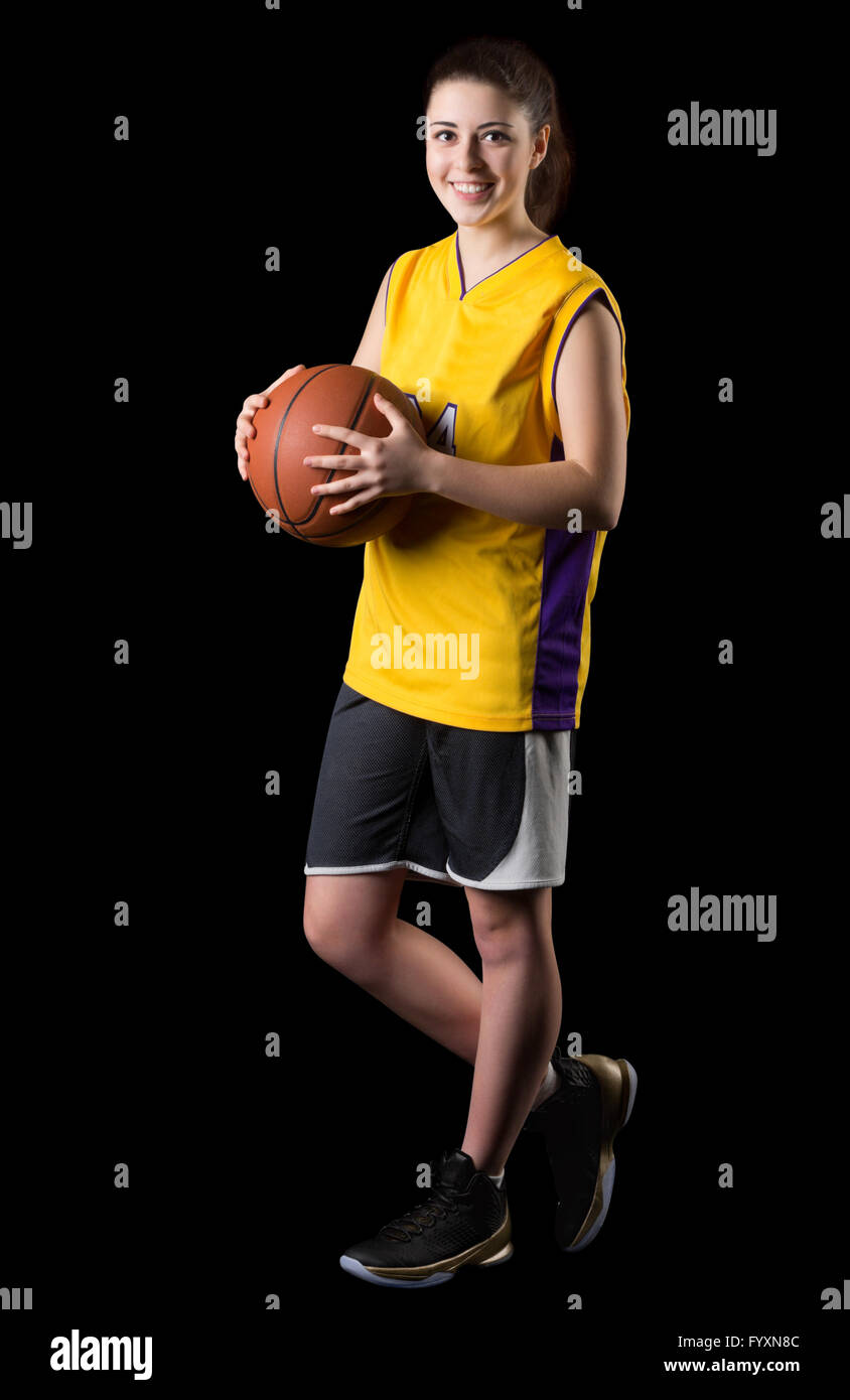 Young girl basketball player isolated Stock Photo - Alamy