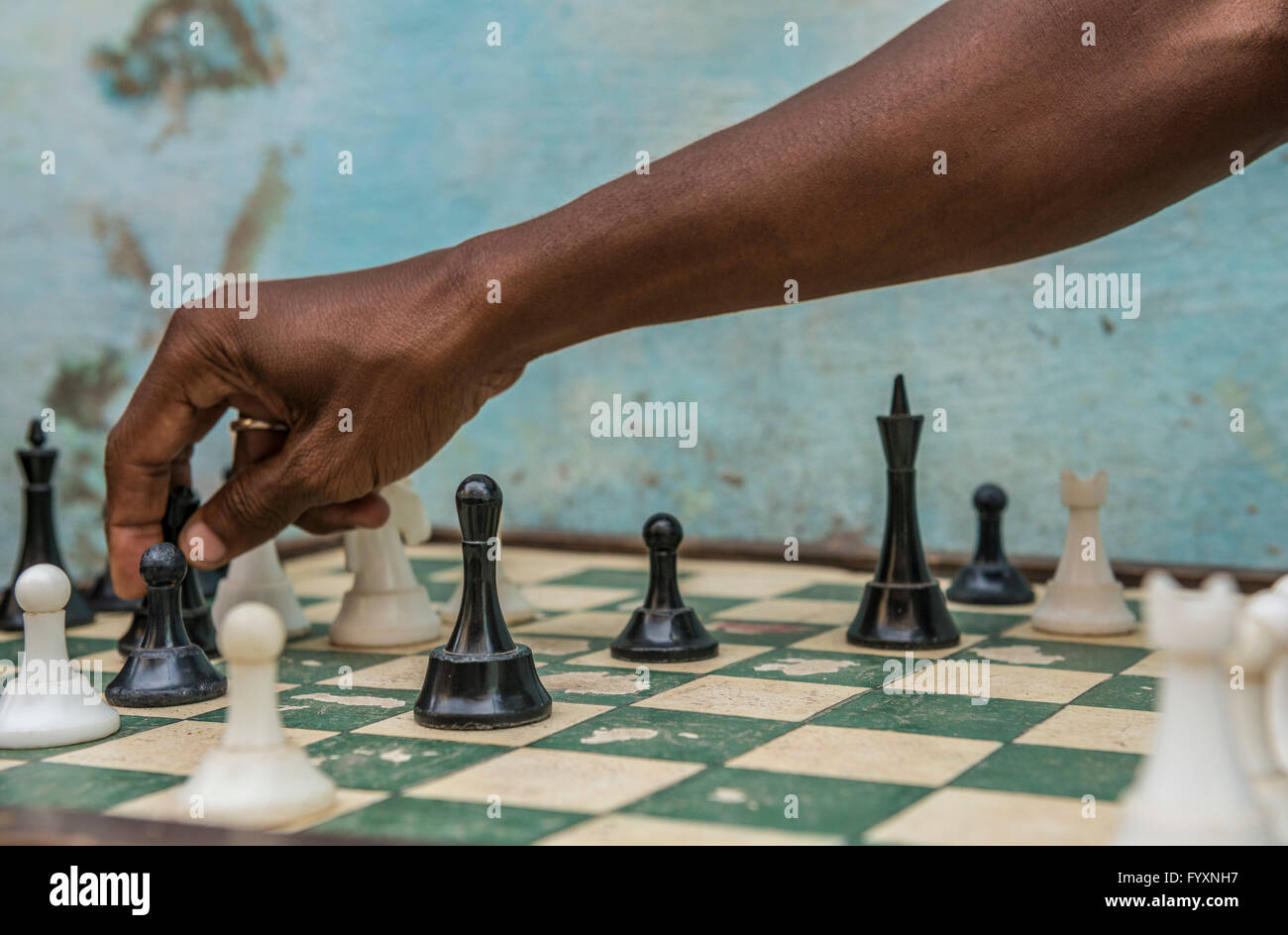 The arm of a Cuban man playing street chess, close up. Havana Centro ...