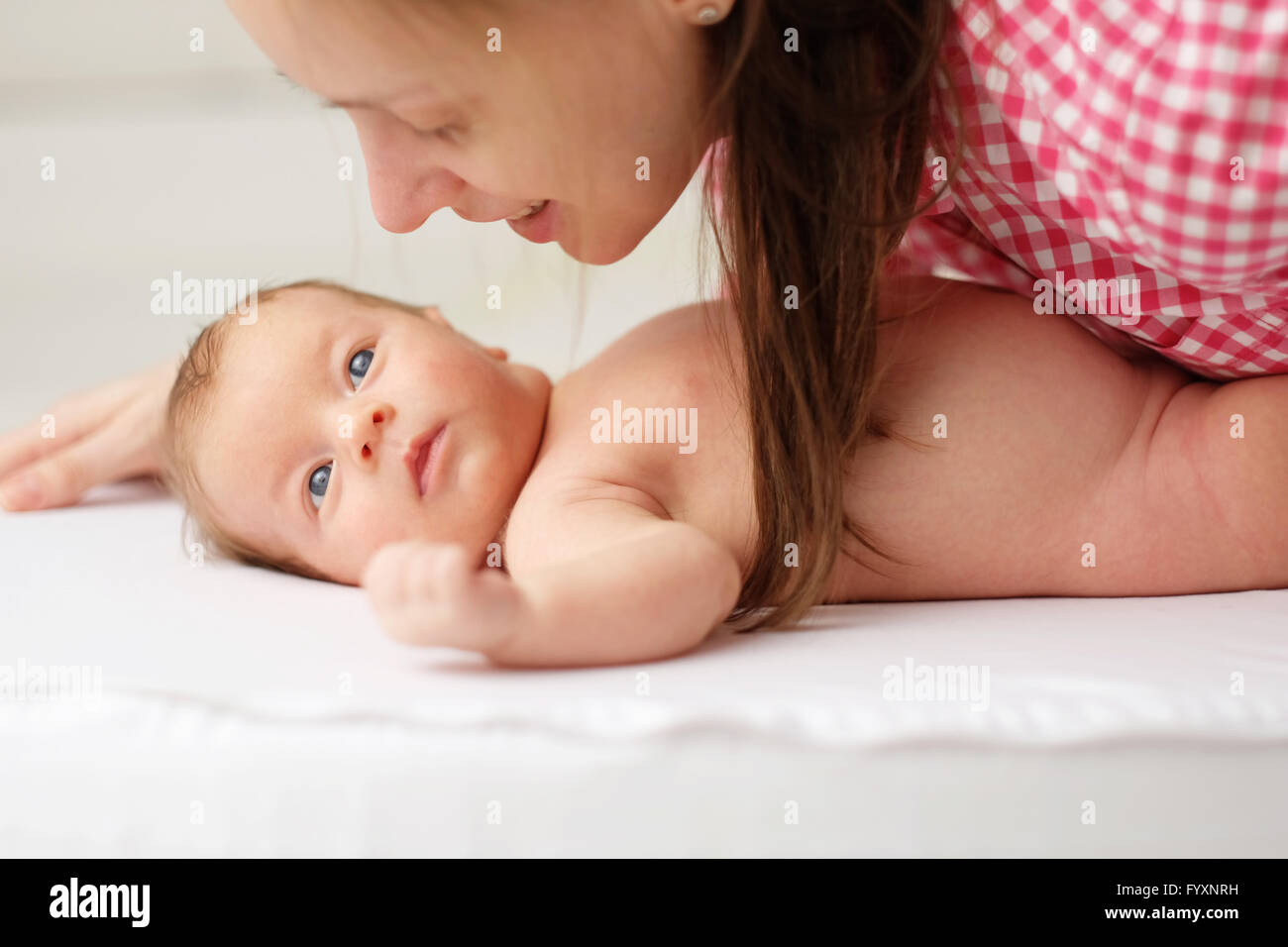 One month old newborn baby with mother Stock Photo - Alamy