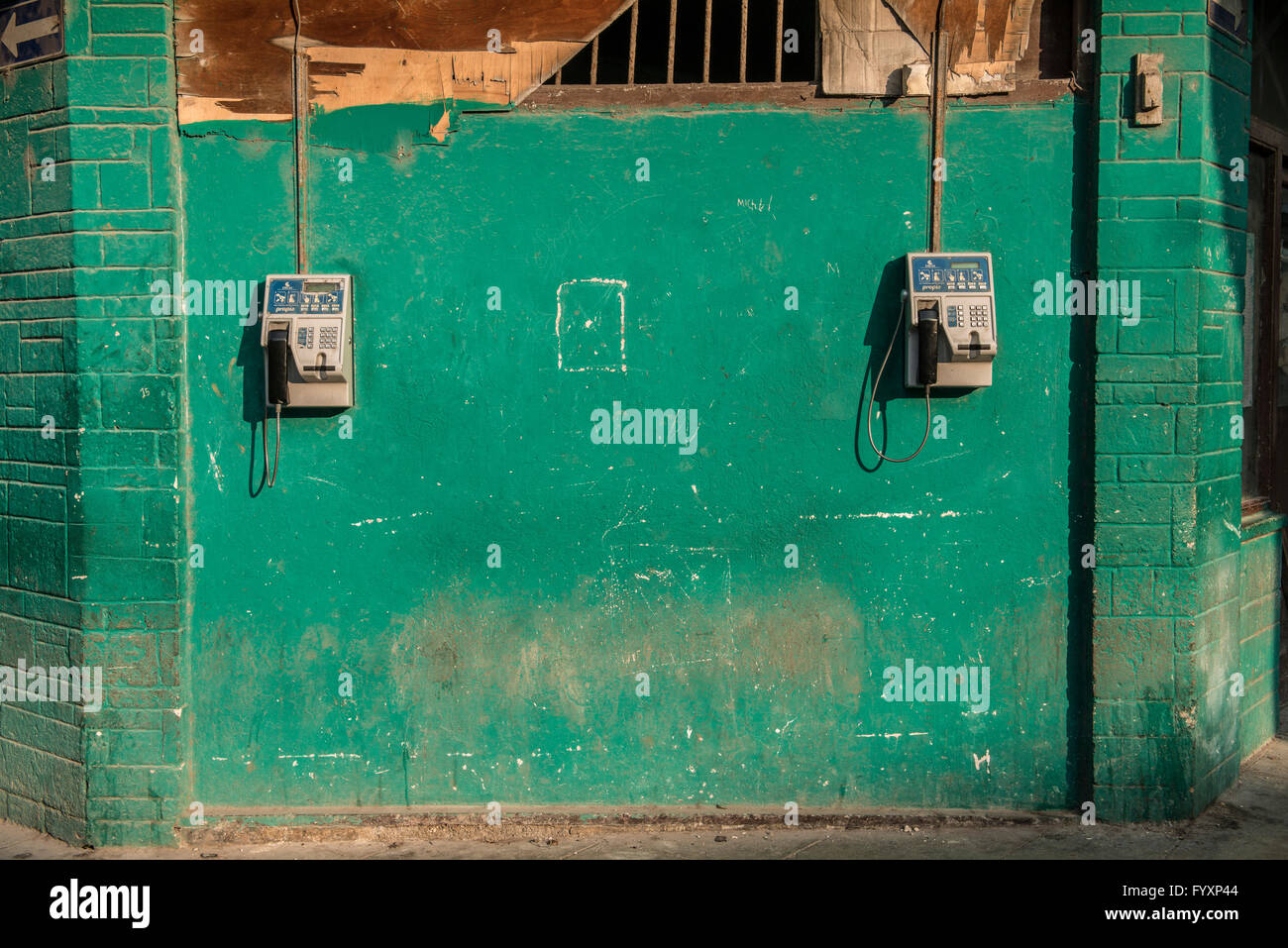 Two public pay phones on a green wall in Havana, La Habana, Cuba Stock ...