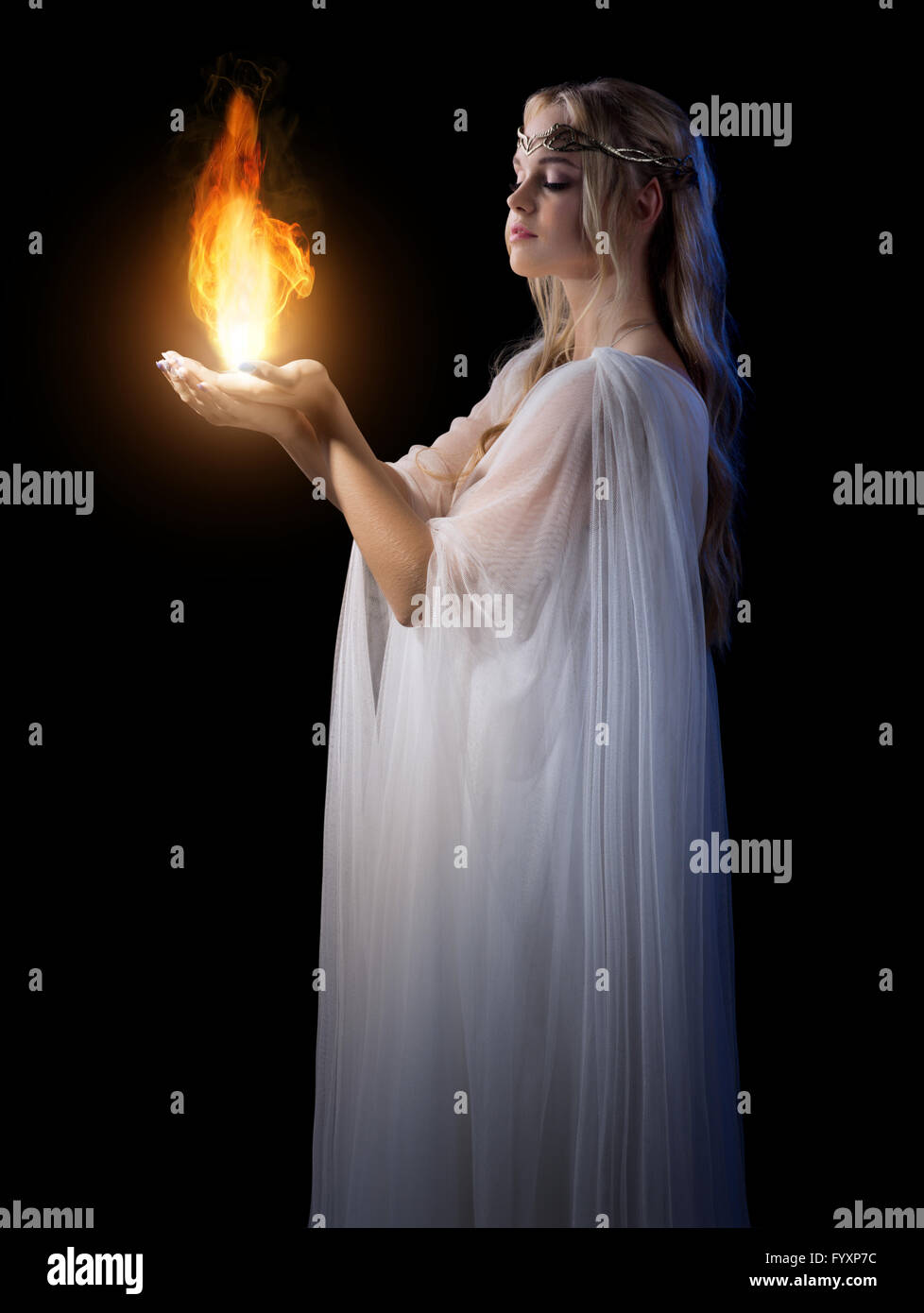 Young elven girl holding fire in palms isolated Stock Photo - Alamy