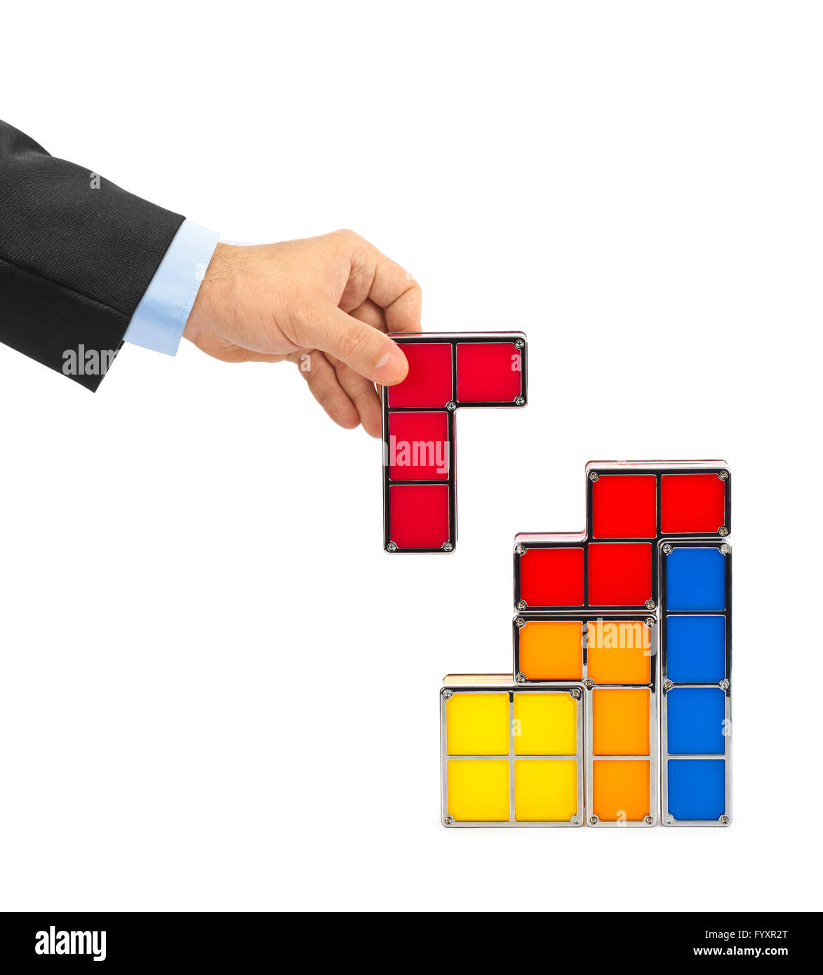 Hand with tetris toy blocks Stock Photo - Alamy