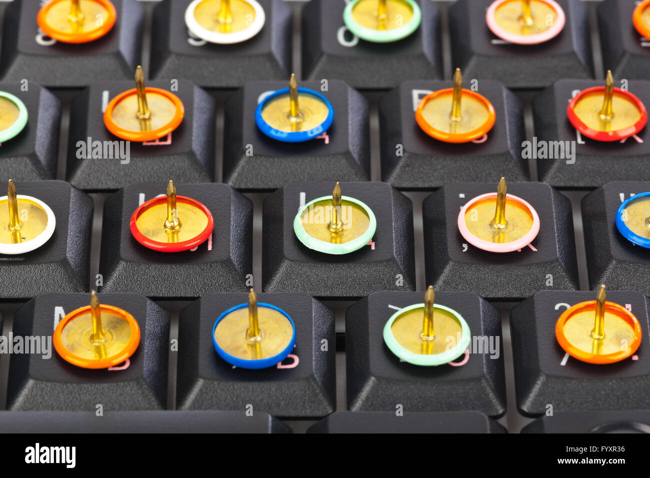 Pins on computer keyboard Stock Photo - Alamy