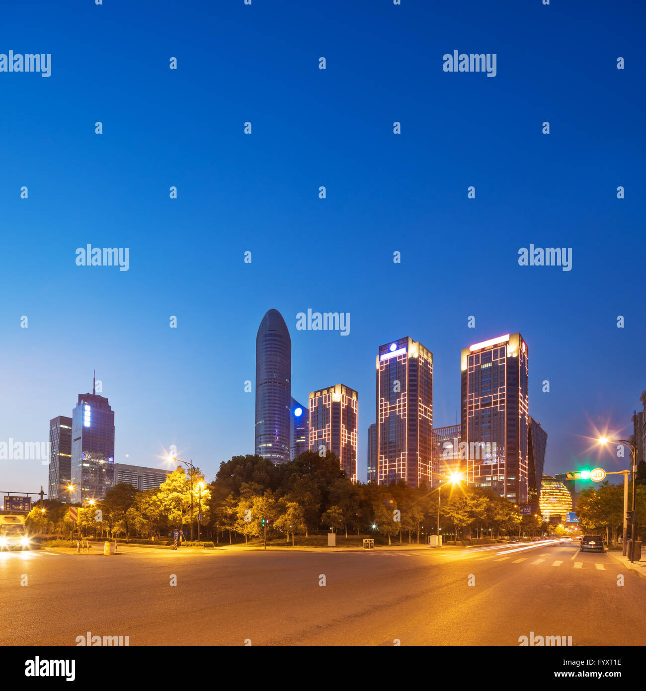 traffic on road and modern building in clear sky at dawn Stock Photo ...