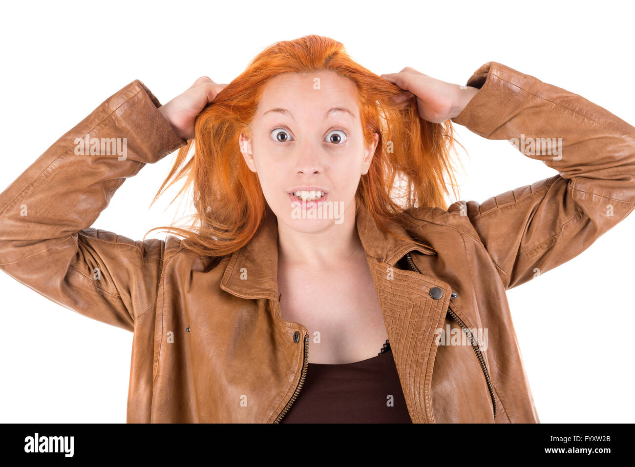 Stressed red hair girl isolated in white Stock Photo - Alamy