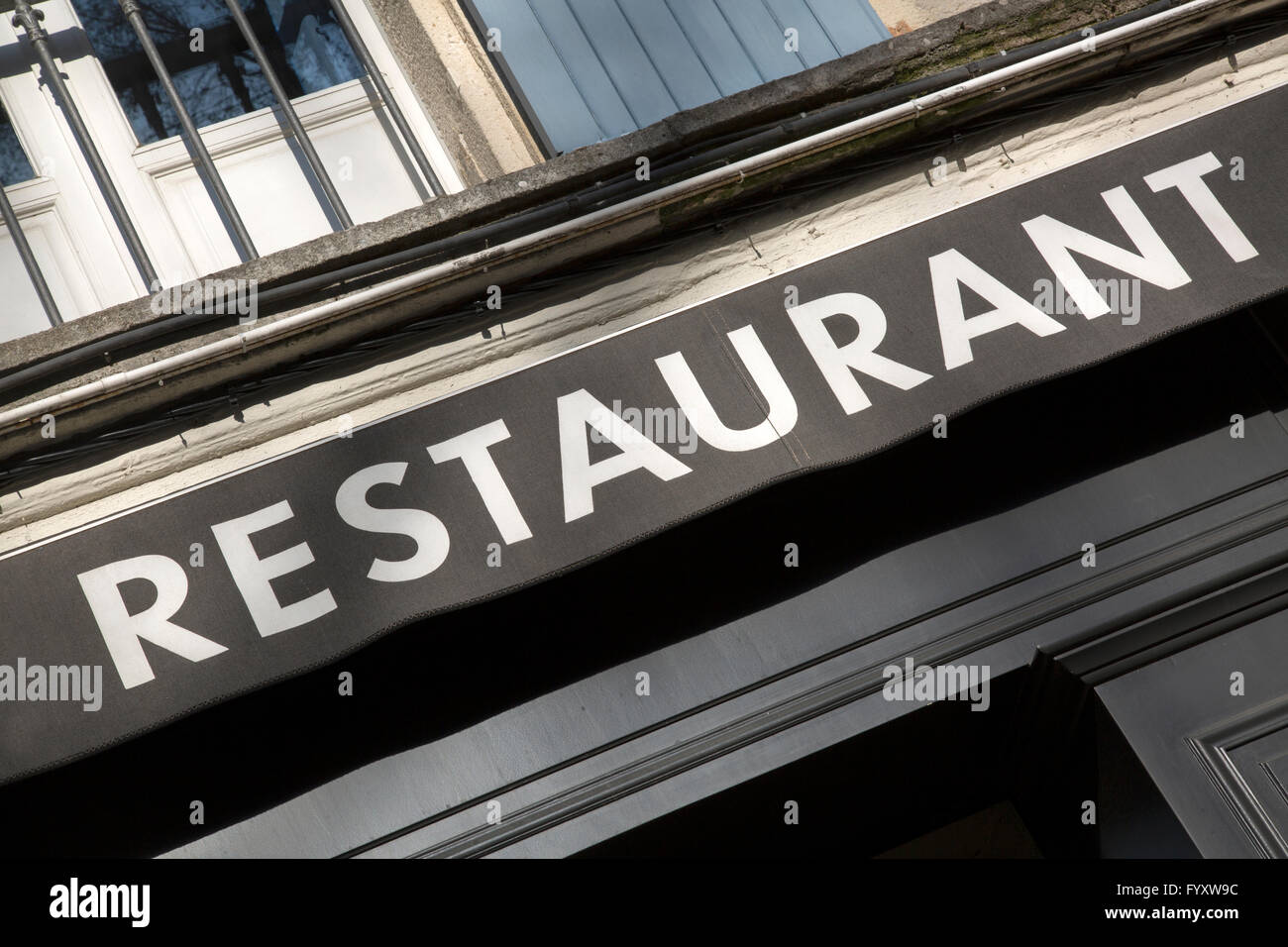 Restaurant Sign on Building Facade Stock Photo - Alamy